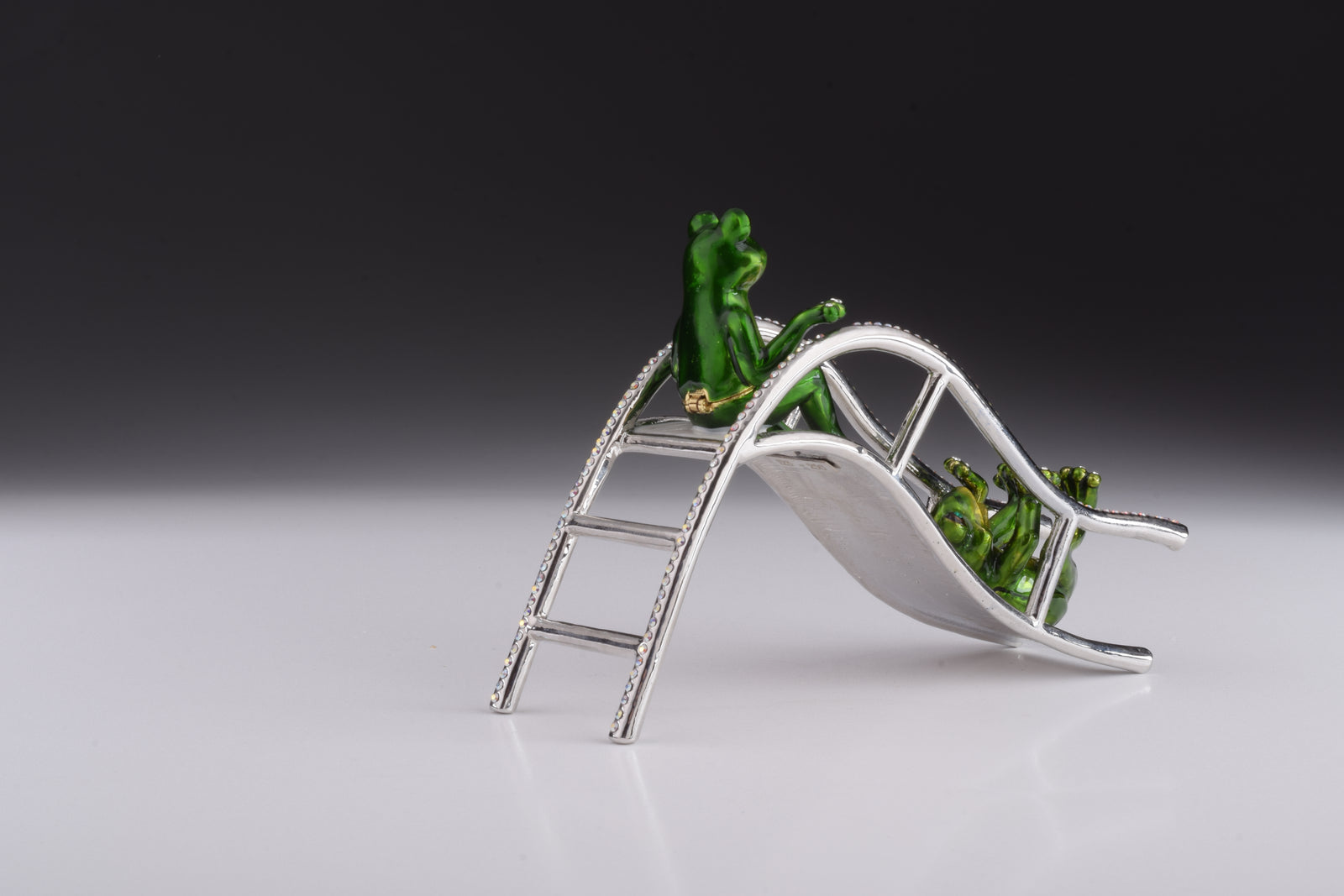 Two Frogs Riding Slide